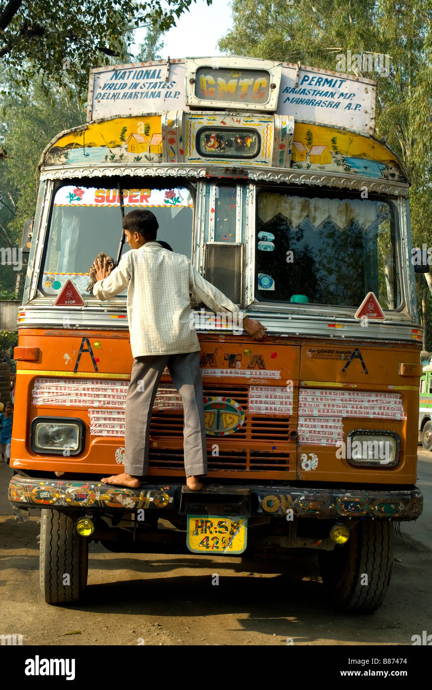 Cleaning a bus, India Stock Photo - Alamy