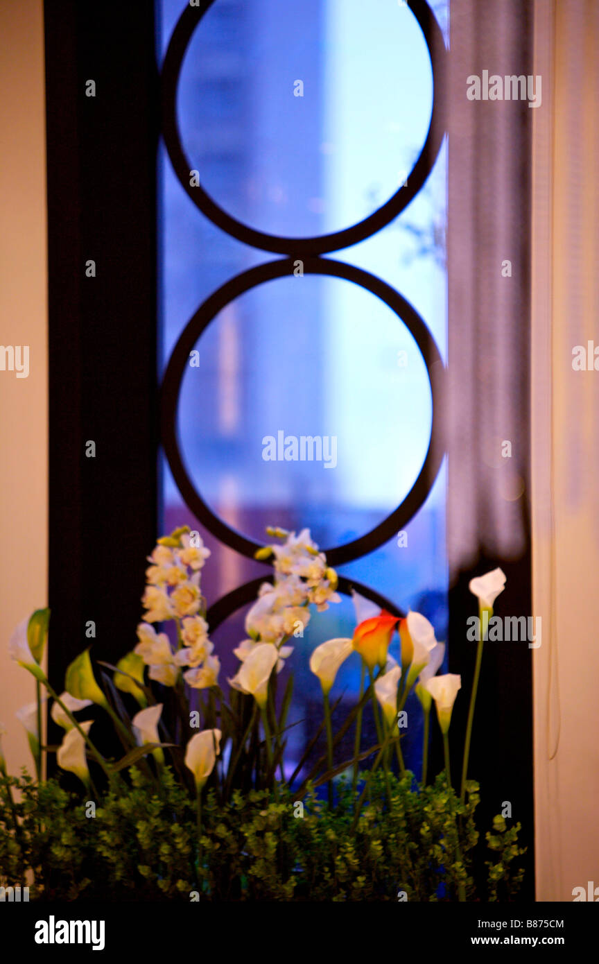 Window with flowers on window ledge Stock Photo - Alamy