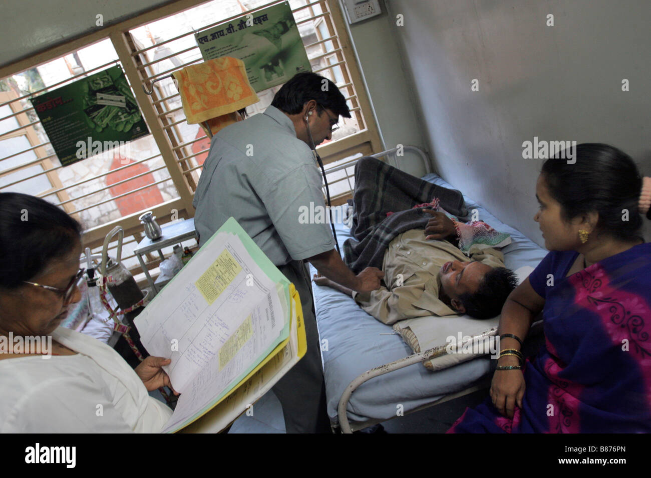 An Indian doctor looks after patients affected by hiv and aids in a ...