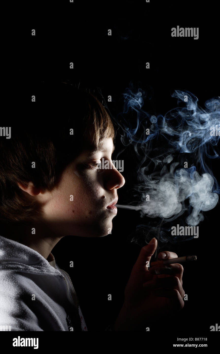 Boy smoking a cigarette Stock Photo - Alamy