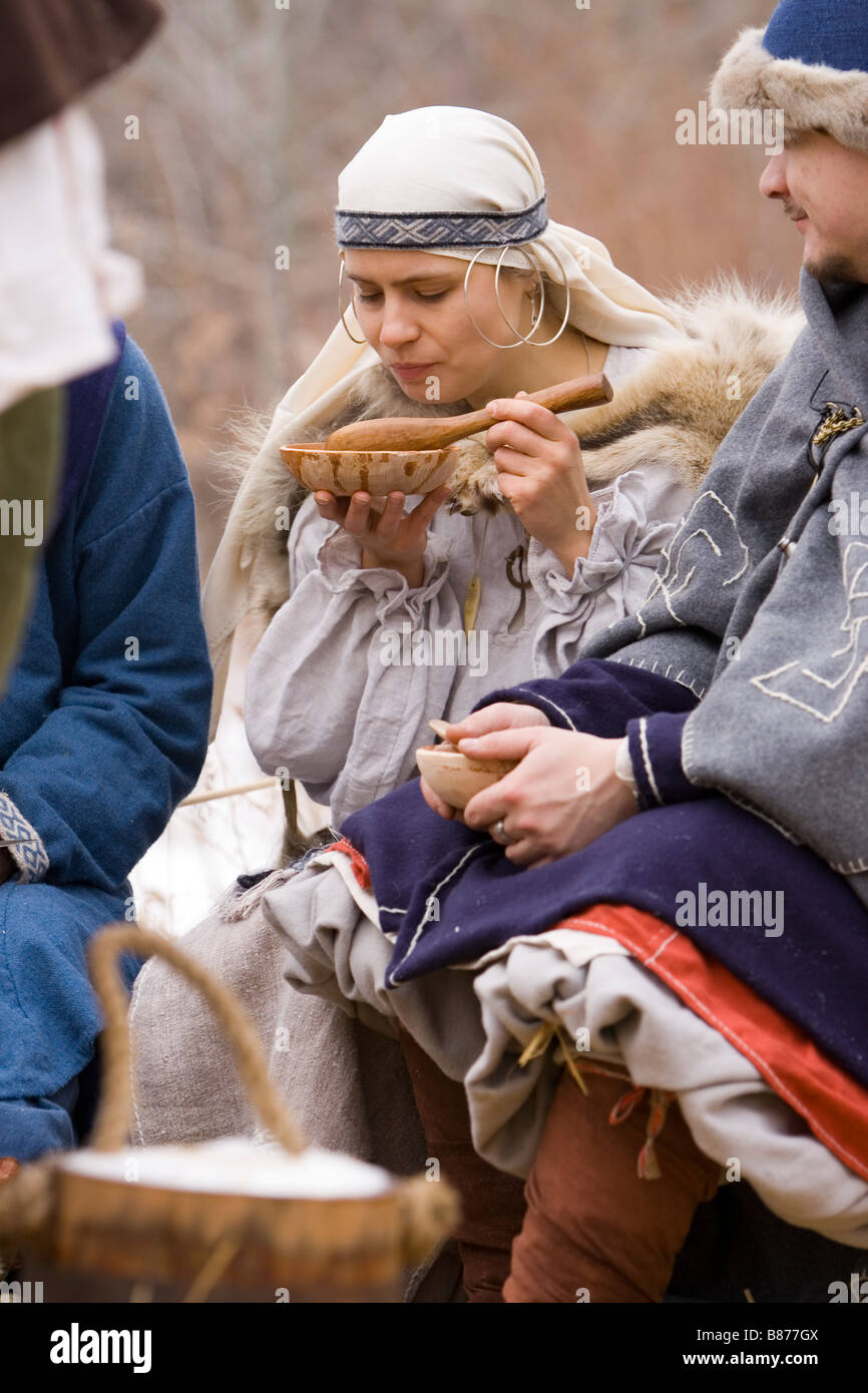 people dressed like a viking sitting and eating Stock Photo - Alamy
