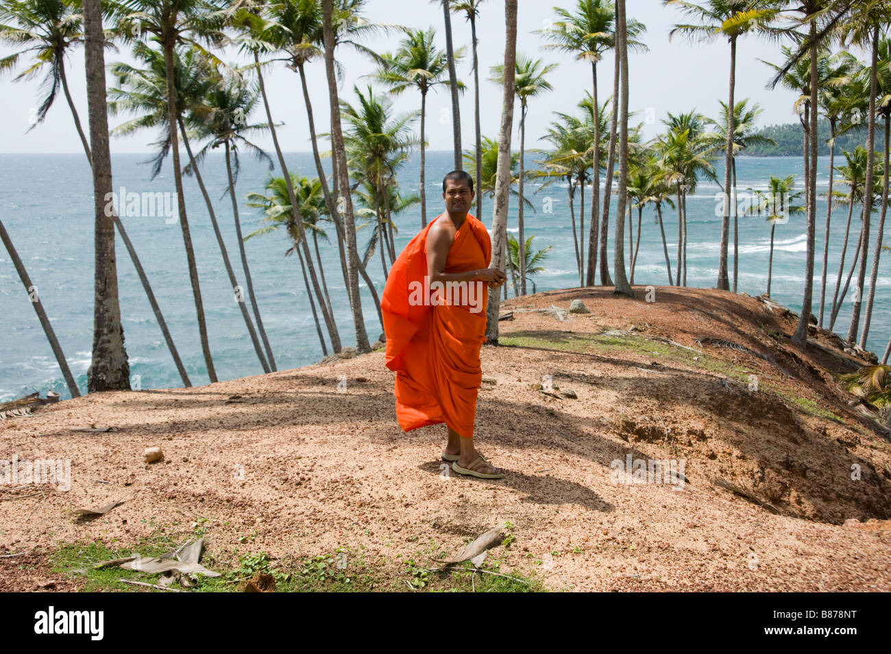 Monk by trees and sea Sri Lanka 3697 Stock Photo - Alamy
