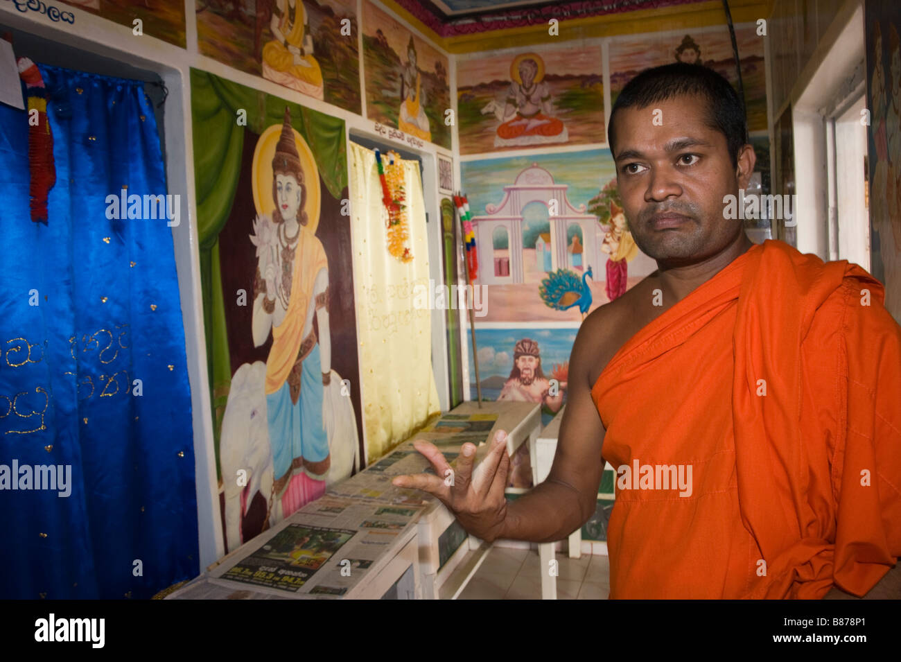 Monk shows painting of Buda Sri Lanka 3697 Stock Photo - Alamy