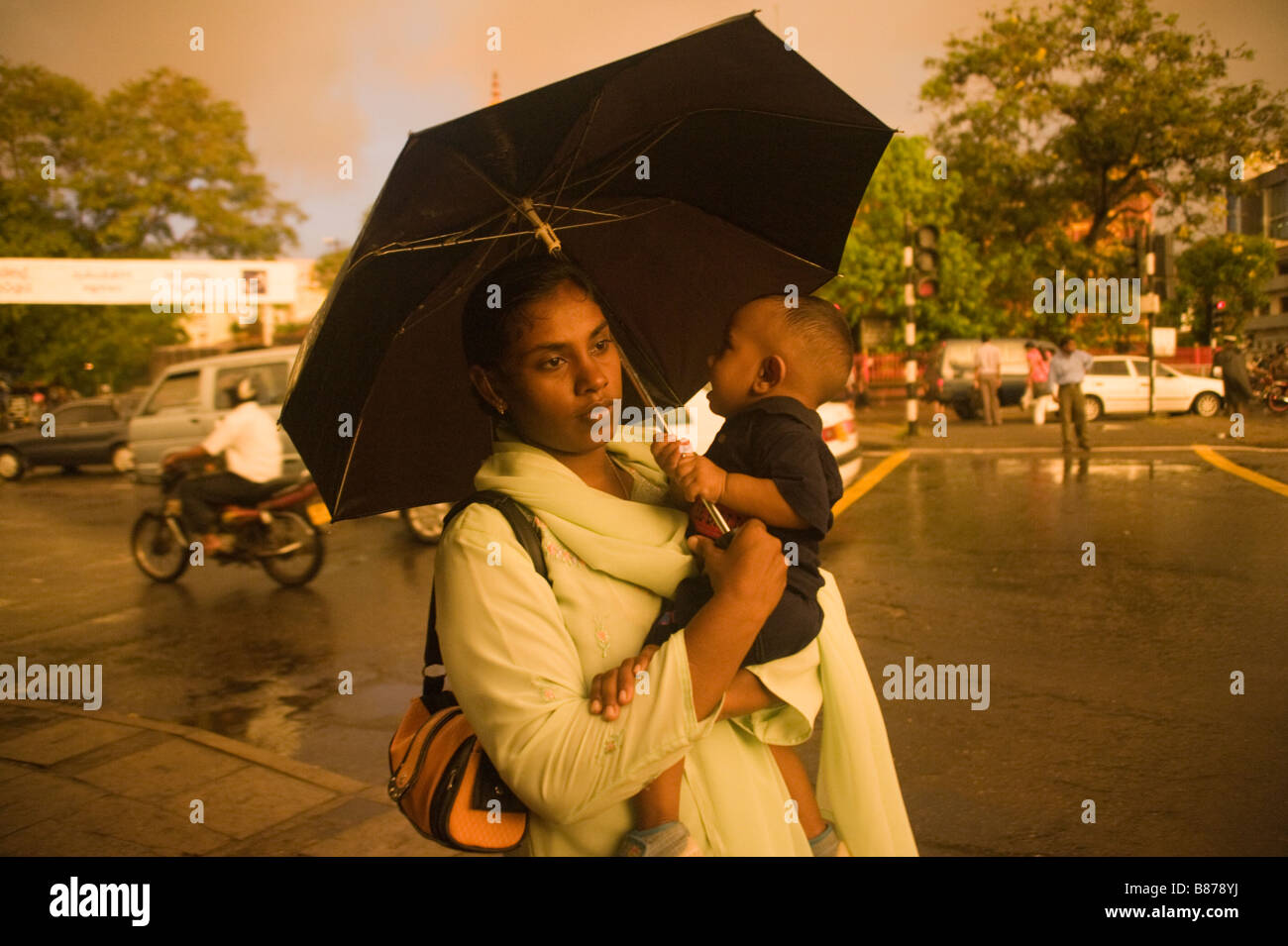 Woman walking in rain baby hi-res stock photography and images - Alamy