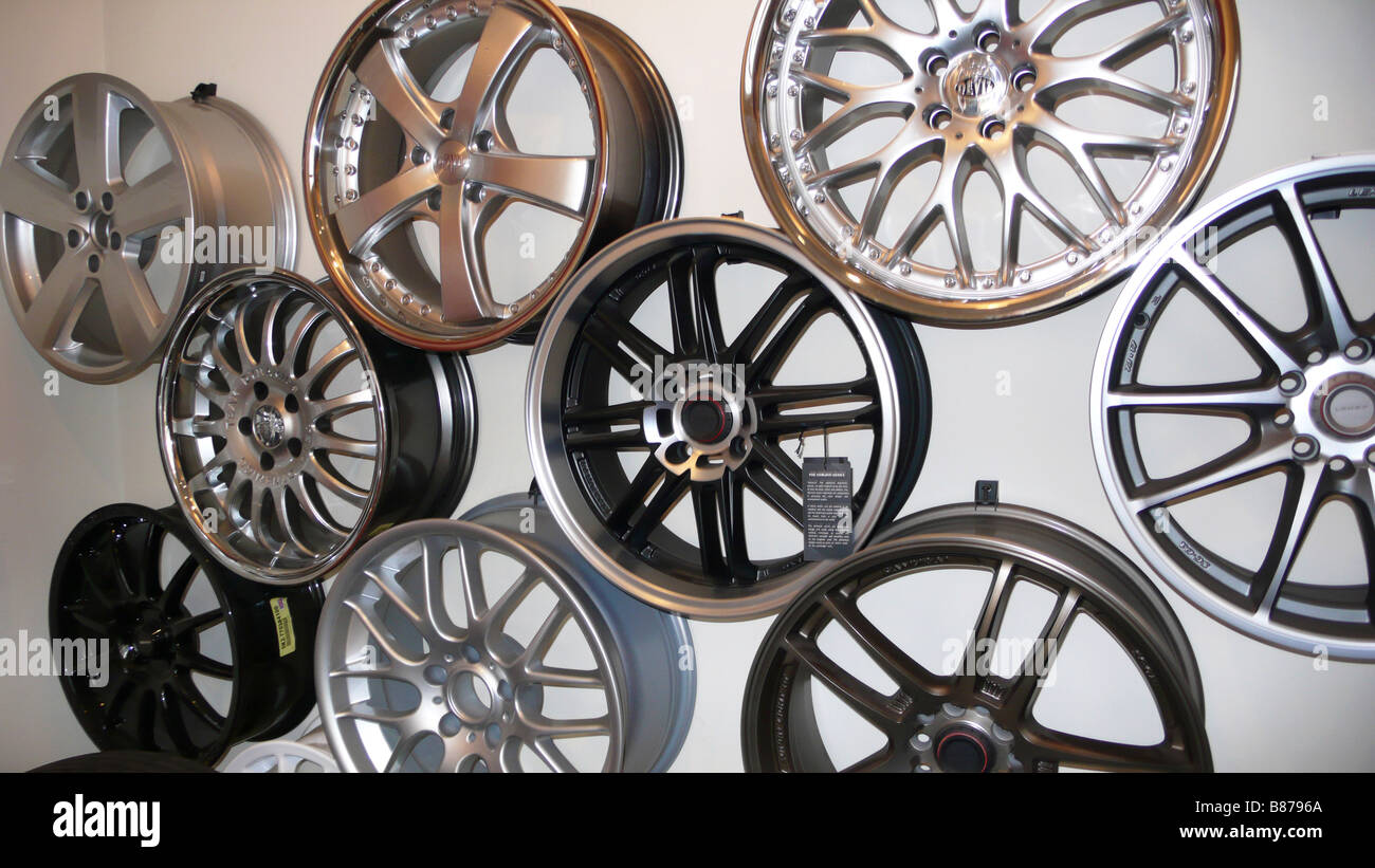 New alloy wheels for car in show room Stock Photo - Alamy