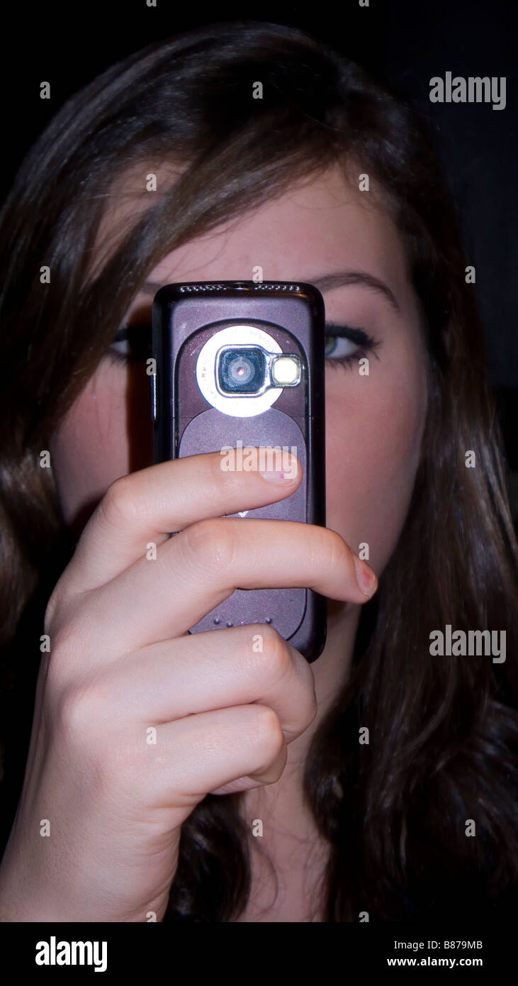 Girl using photo camera Teenagers Model released Stock Photo - Alamy