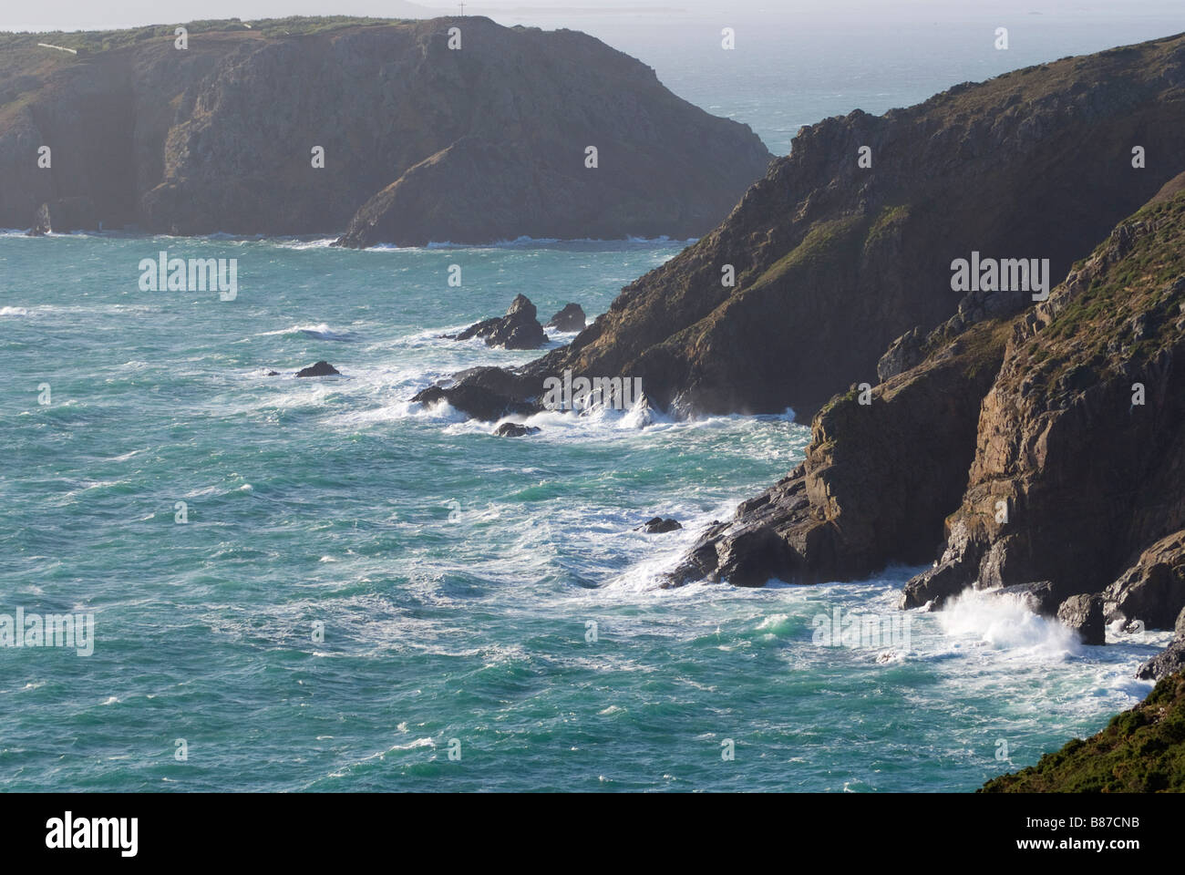 Waves breaking against the rocky coastline Gouliot headland and island ...