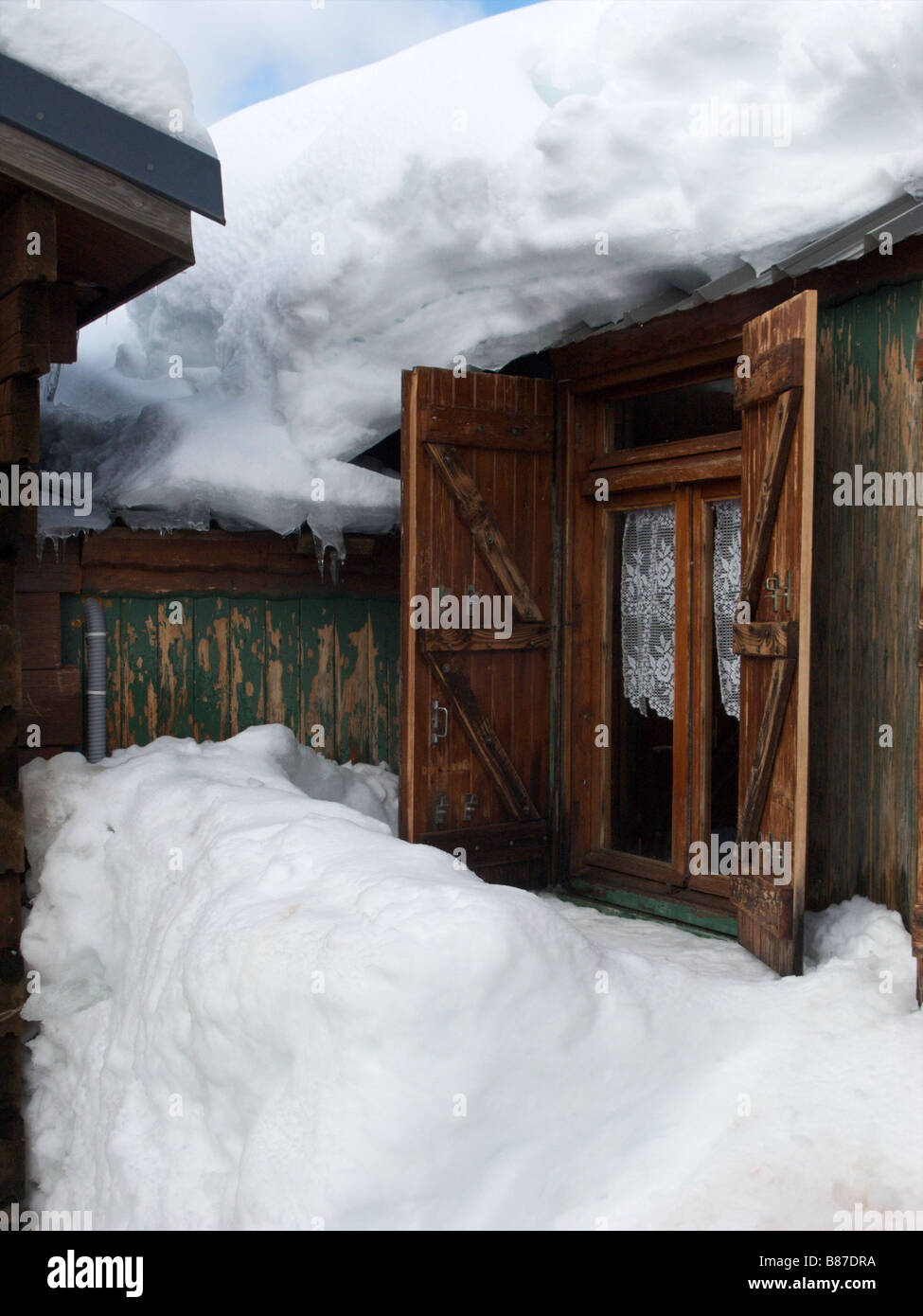 A chalet window covered in snow Stock Photo - Alamy