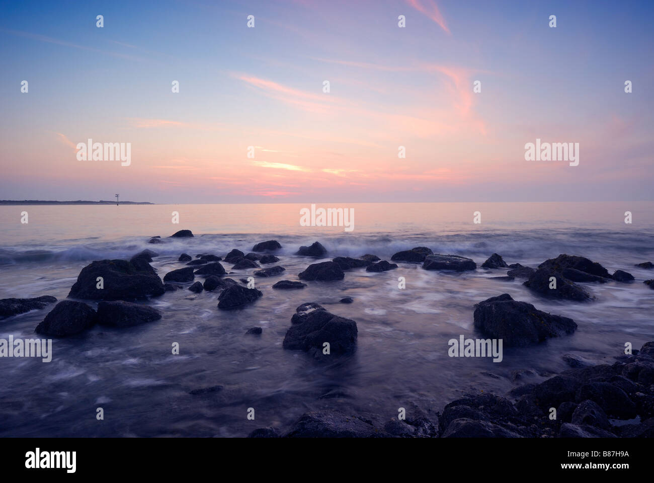 sunset and waves taken with a slow shutter speed Stock Photo - Alamy