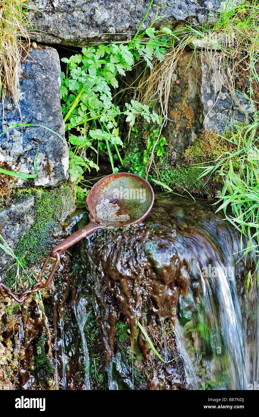 ancient pilgrims stoop for drinking water with chained ladle for ...