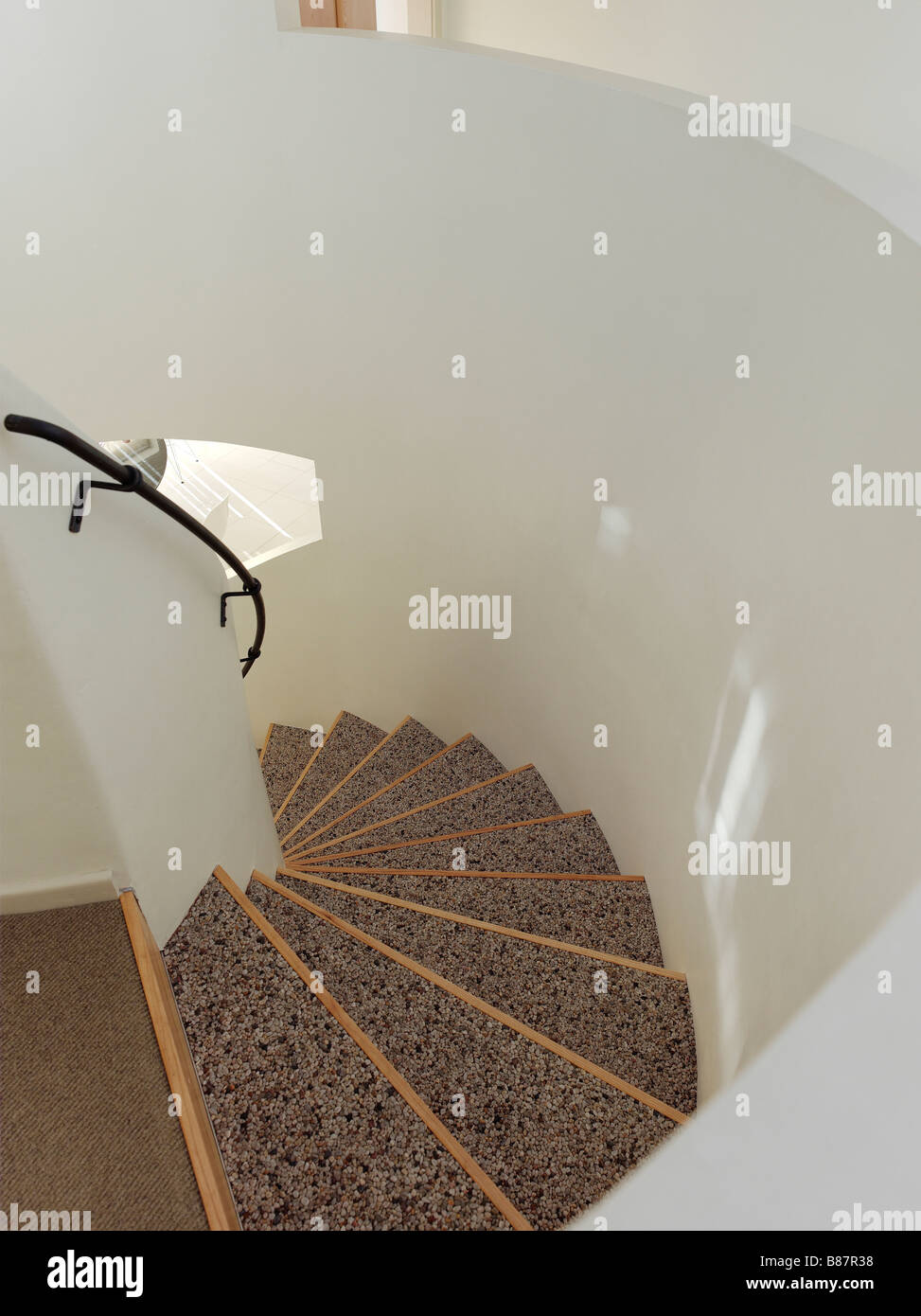 Simple contemporary staircase with white walls and handrail Stock Photo ...