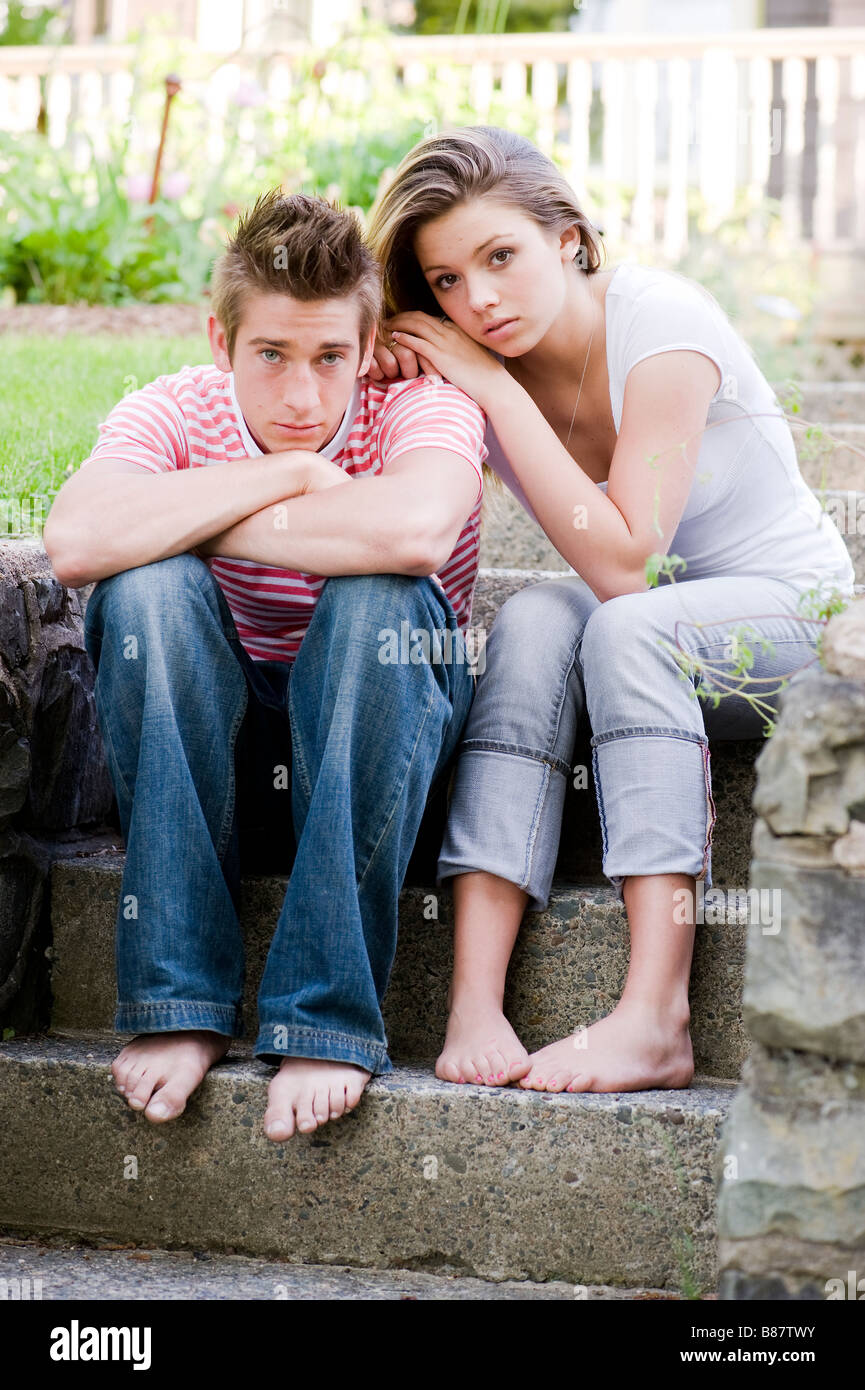 A young couple sitting together Stock Photo - Alamy