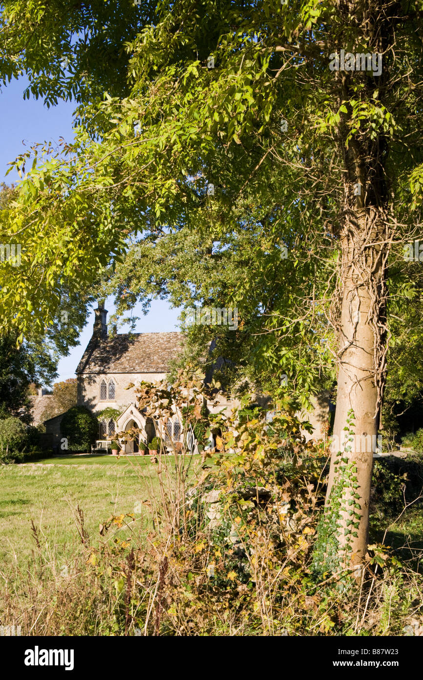 A house opposite the church in the Cotswold village of Cherington ...