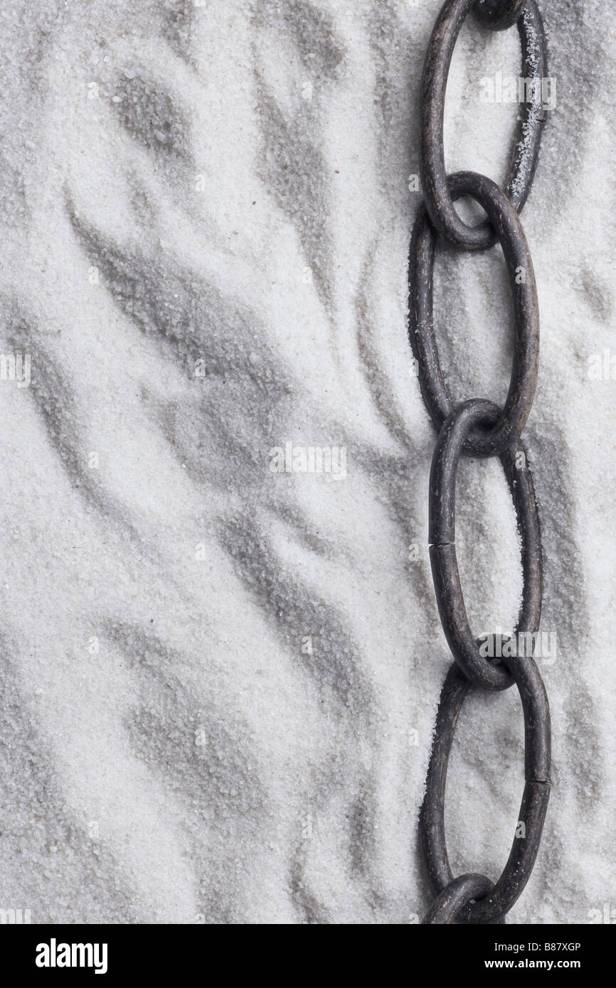 iron chain in sand border Stock Photo - Alamy
