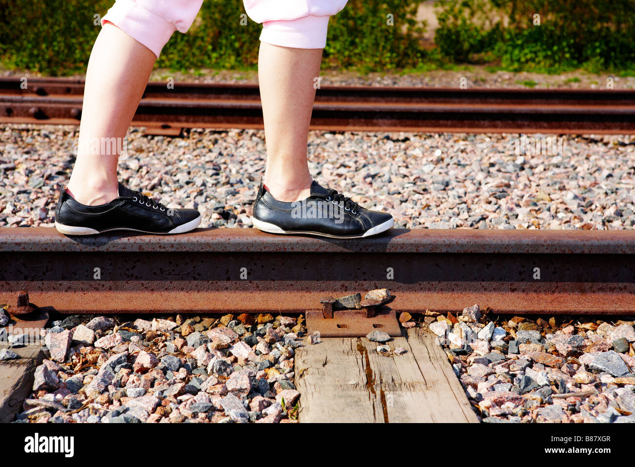 Feet up on rail hi-res stock photography and images - Alamy