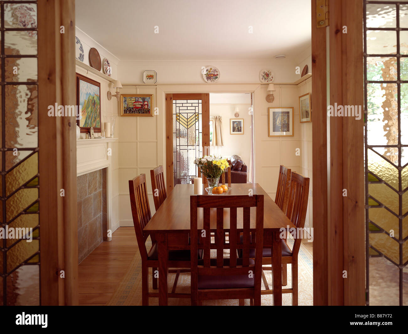 dining room with glass doors and dining table Stock Photo - Alamy