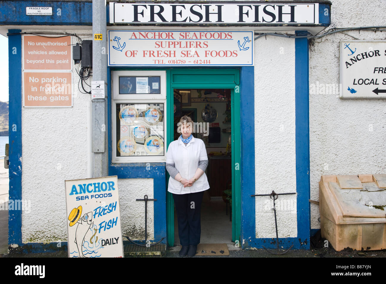 Lady fish monger outside her shop on the island of Skye Scotland UK ...