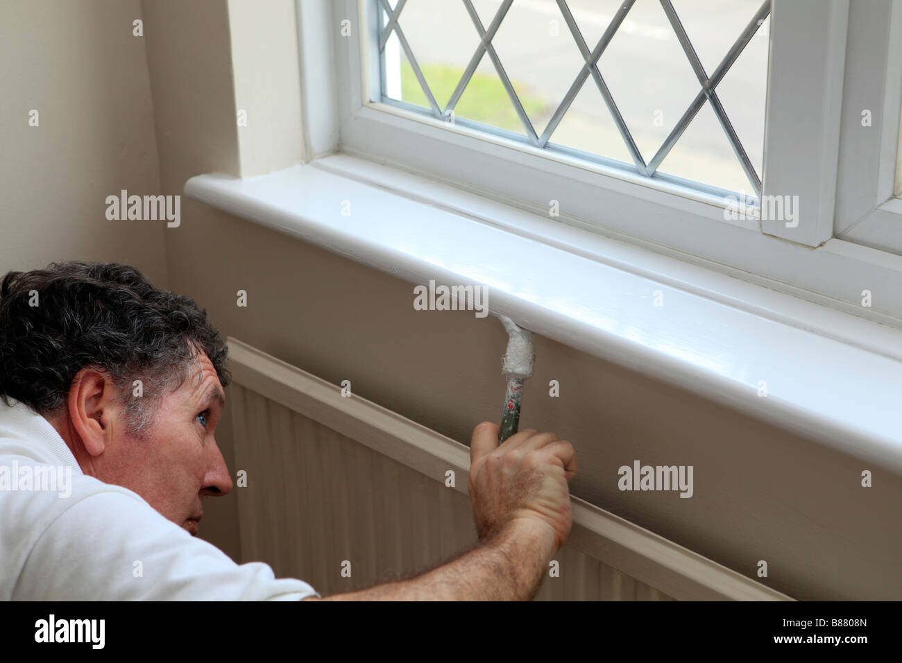 united kingdom a decorator at work in a private house Stock Photo - Alamy