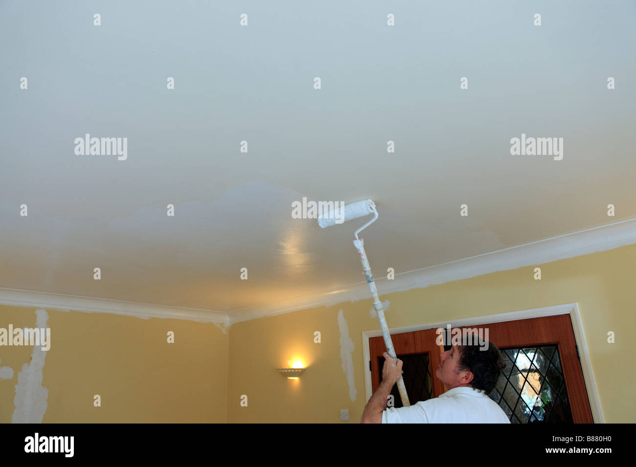 united kingdom a decorator at work in a private house Stock Photo - Alamy