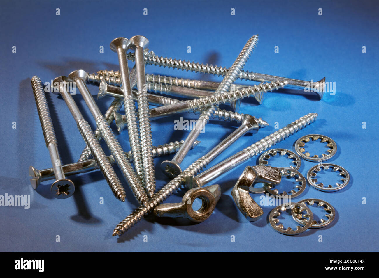 Steel screws, wing nuts and internal tooth lock washers Stock Photo - Alamy