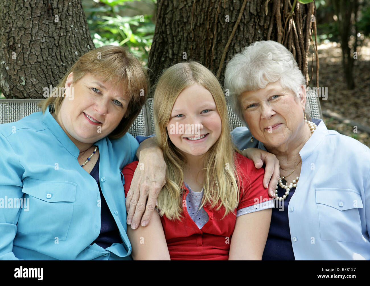 Three generations a little girl her mother and her grandmother All with ...