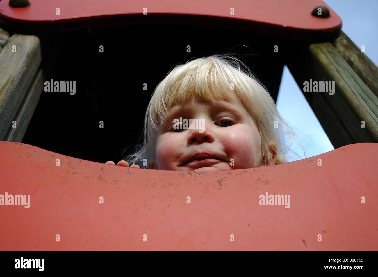 Child peering peer peeking hi-res stock photography and images - Alamy