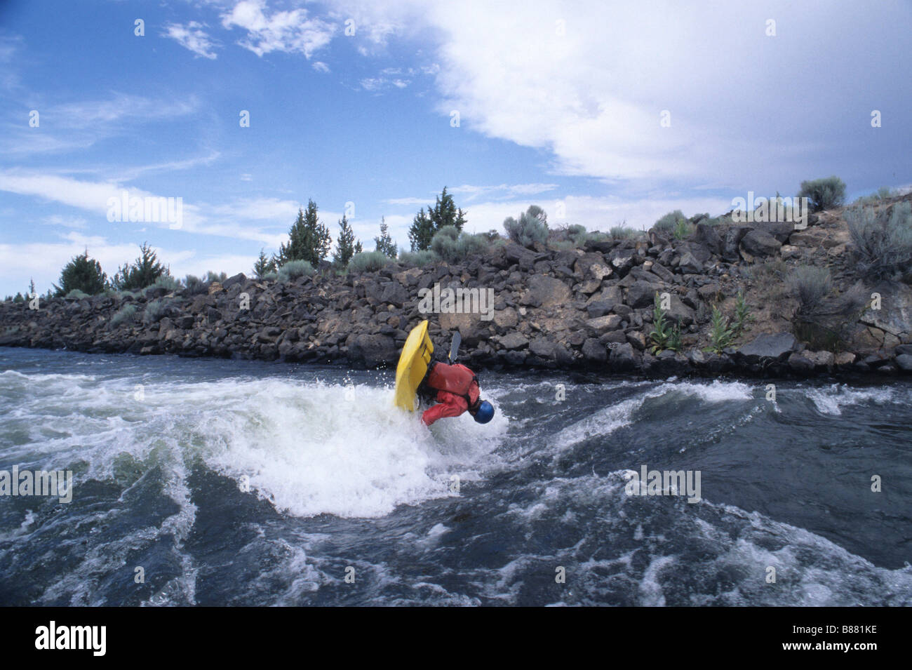 A kayaker performes a kayaking trick called a loop Stock Photo - Alamy