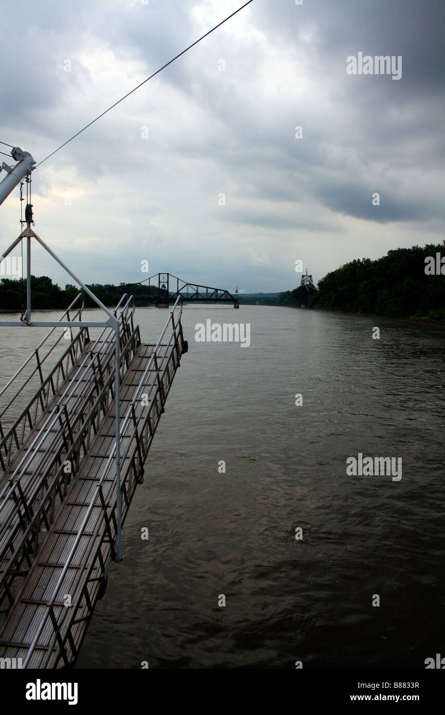 Riverboat's fore landing ramp, lifted above the water while going ...