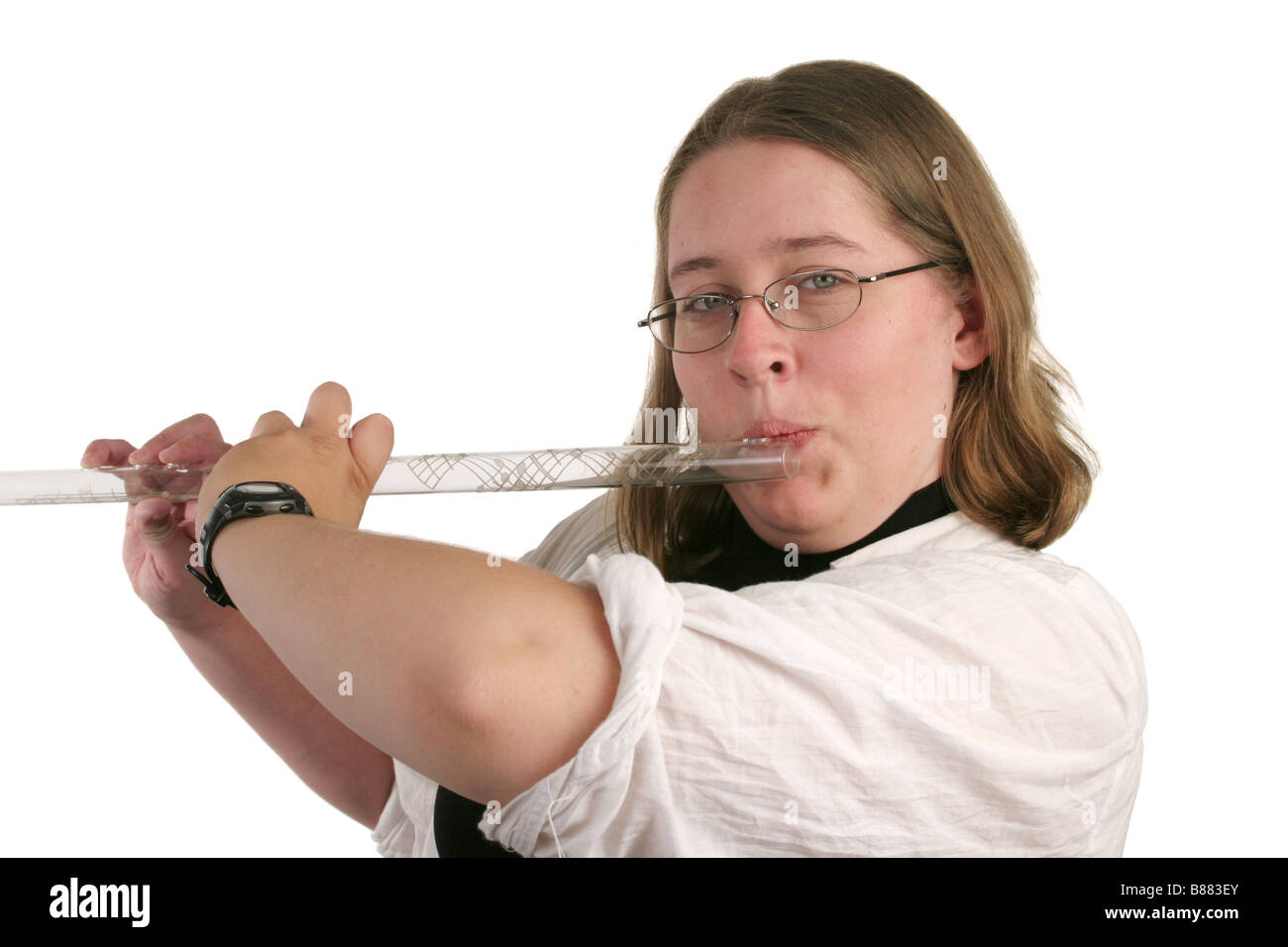 A college aged student learning to play a glass flute Stock Photo - Alamy