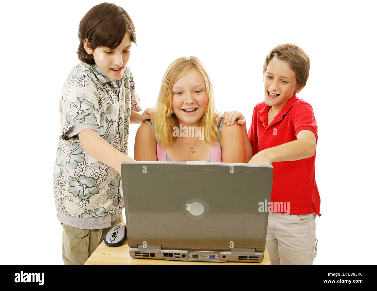 A group of kids having fun using a laptop computer Isolated on white ...