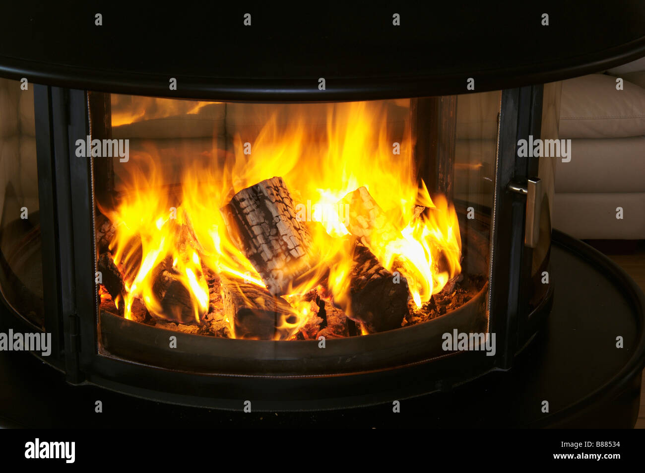 detail of lit circular fireplace Stock Photo - Alamy