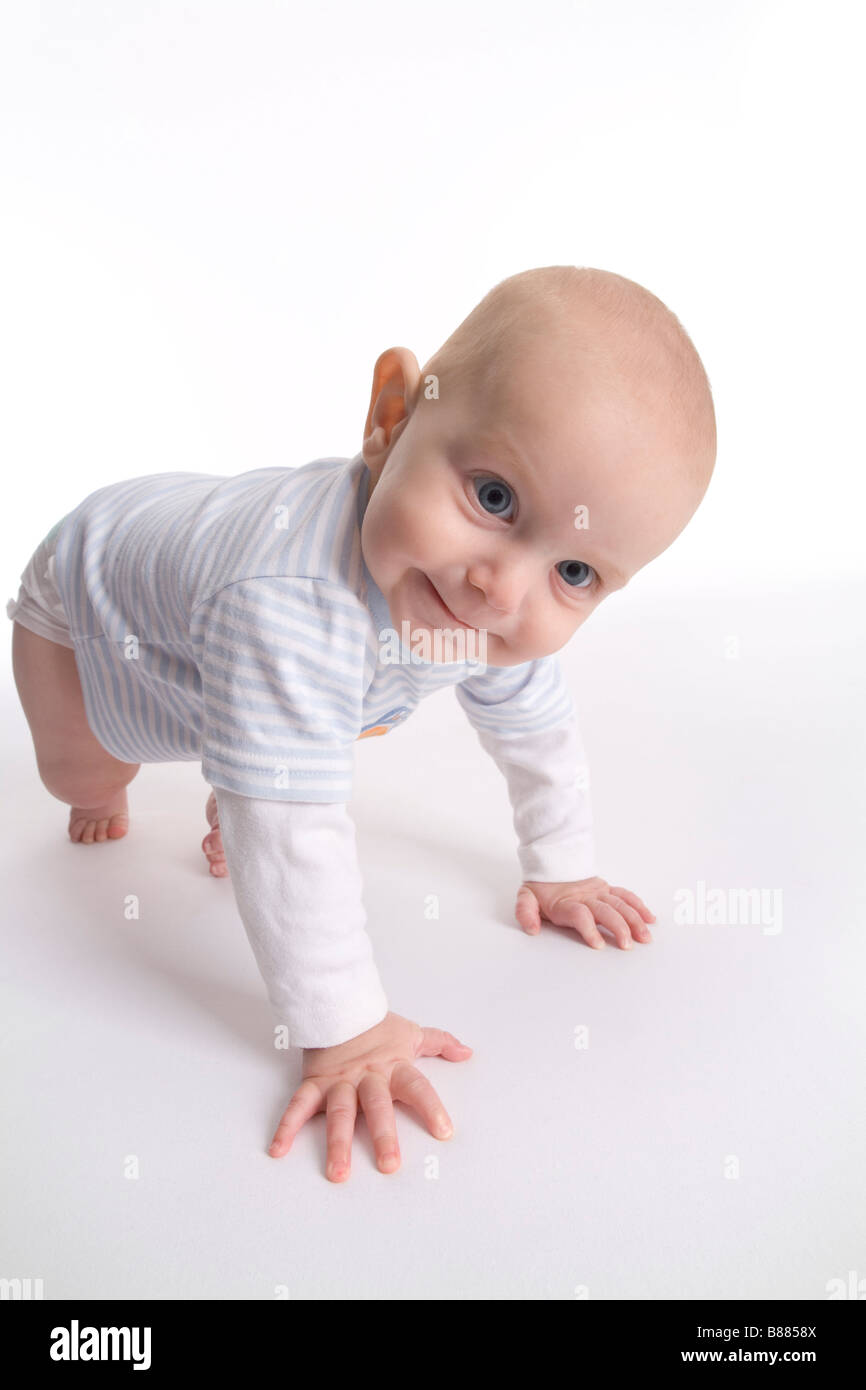 Portrait of a baby boy starting to crawl Stock Photo - Alamy
