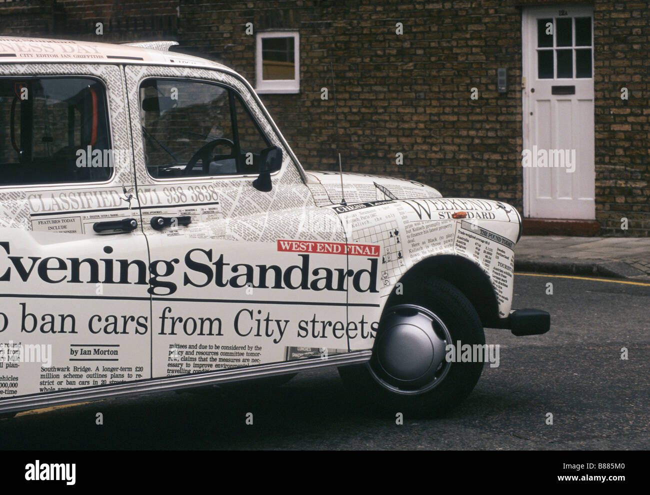 Austin FX4 taxi painted with newspaper print London England UK Stock ...