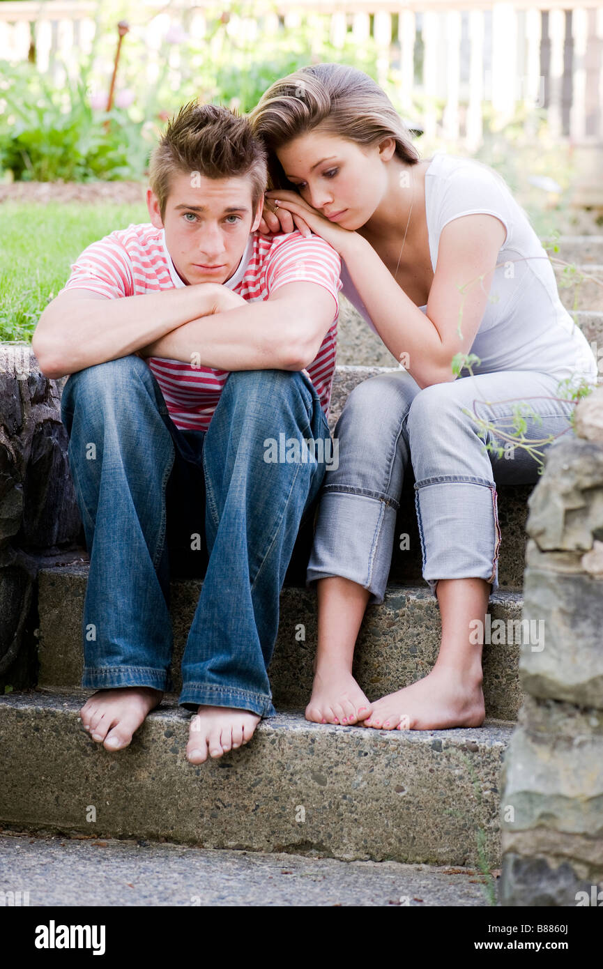 A young couple sitting together Stock Photo - Alamy