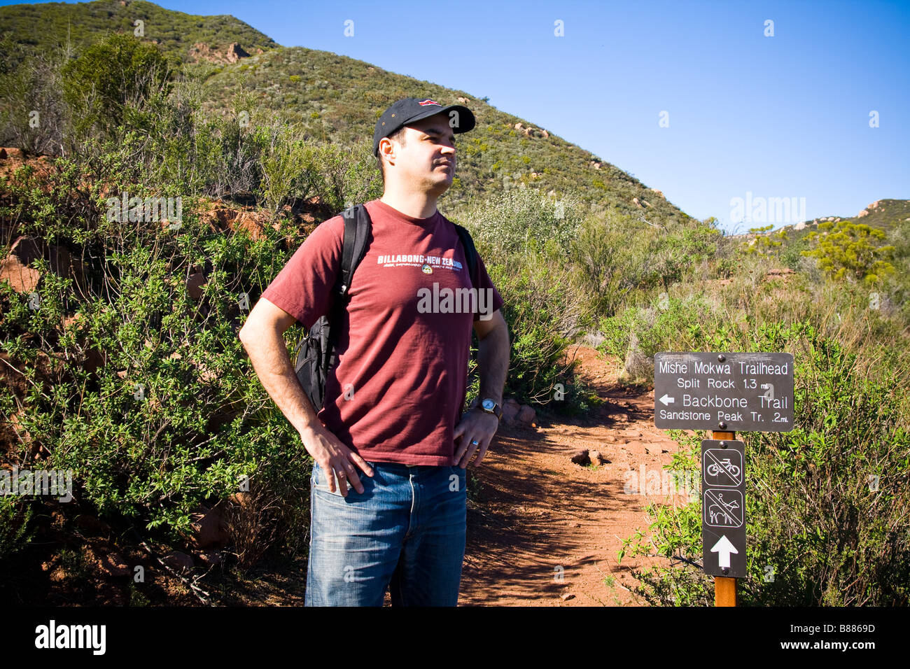 Hiker with sign for mishe mokwa and backbone trail head Santa Monica ...