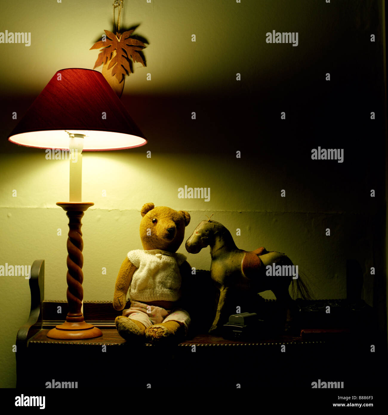 Still life of an old bookcase and antique toys Stock Photo - Alamy