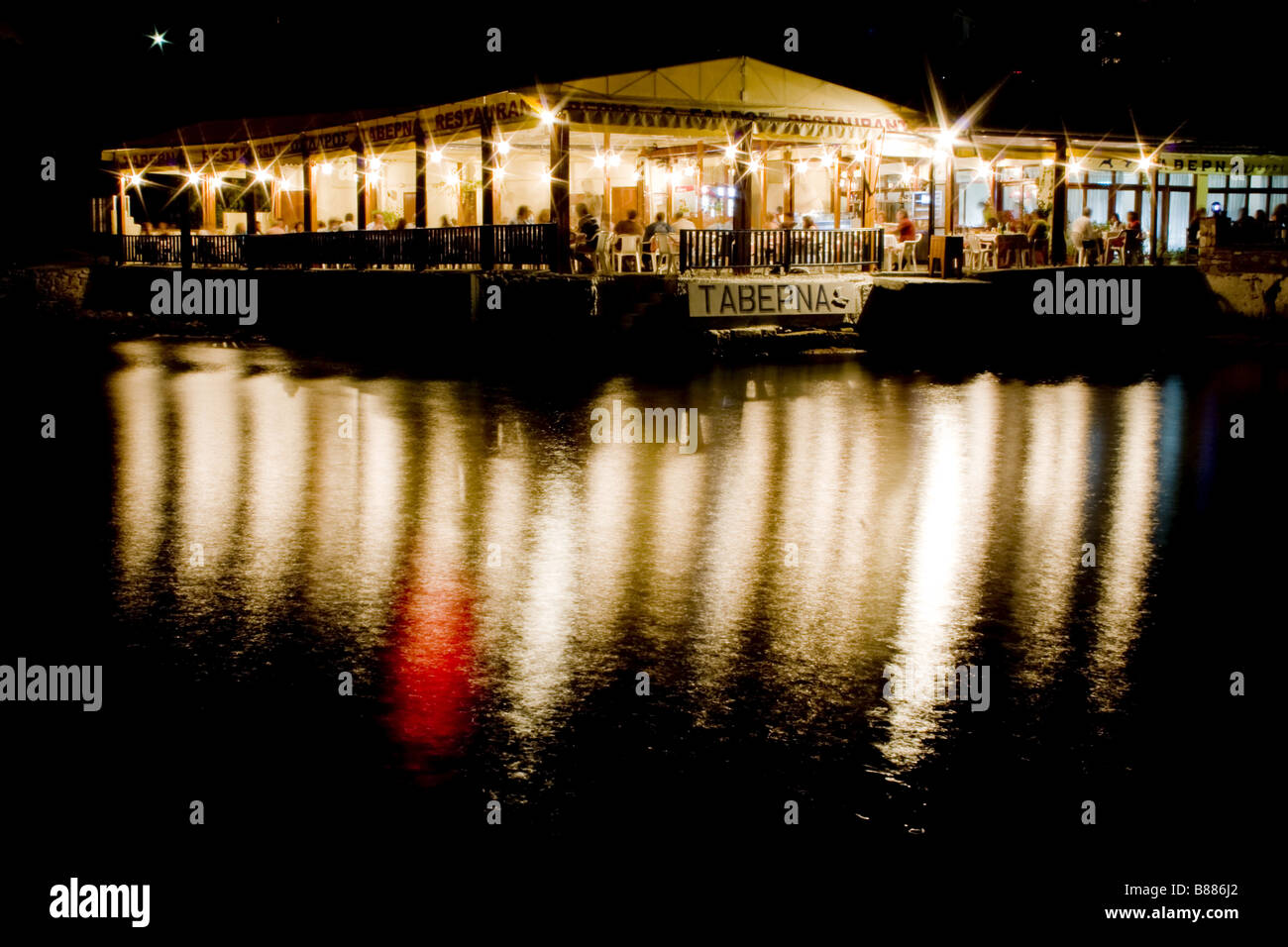 restaurant by the sea, with reflection in the water, Amoliani Island ...