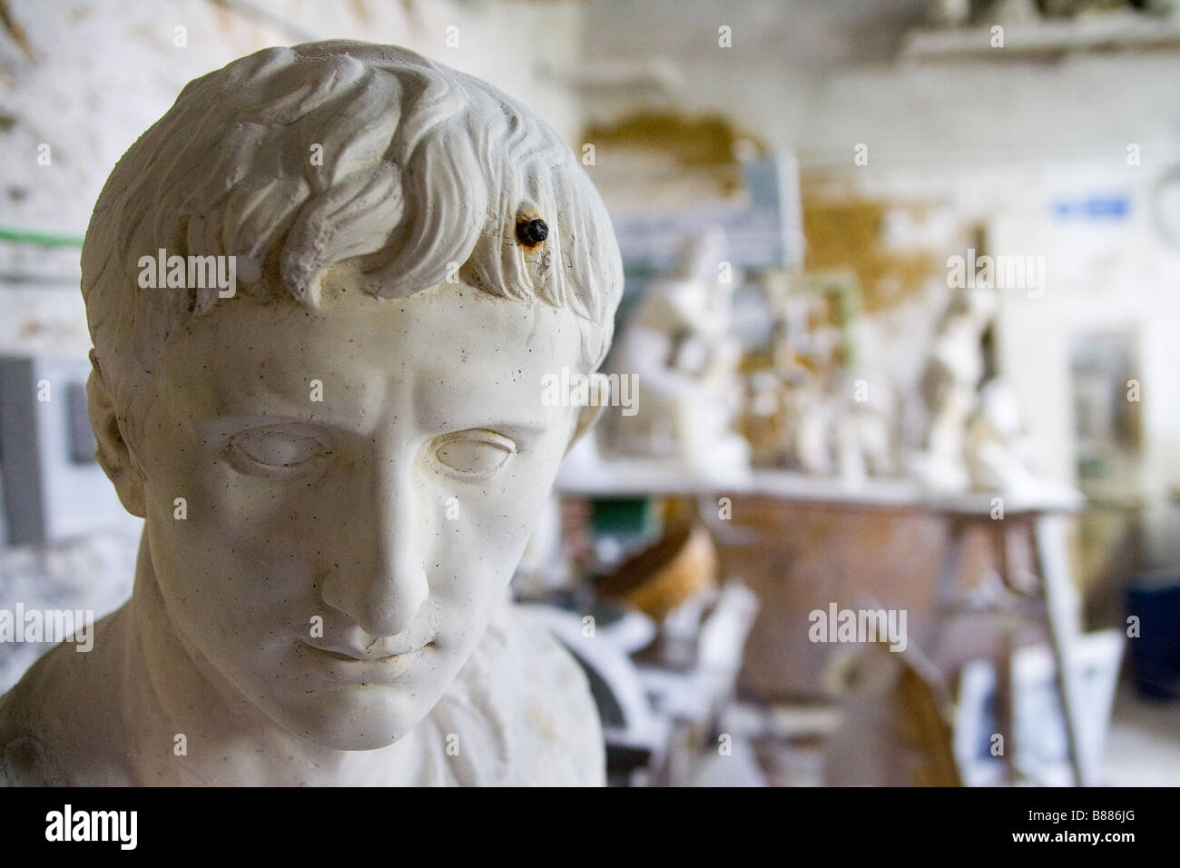 An alabaster carving of a male figure in a shop in Tuscany Italy Stock ...
