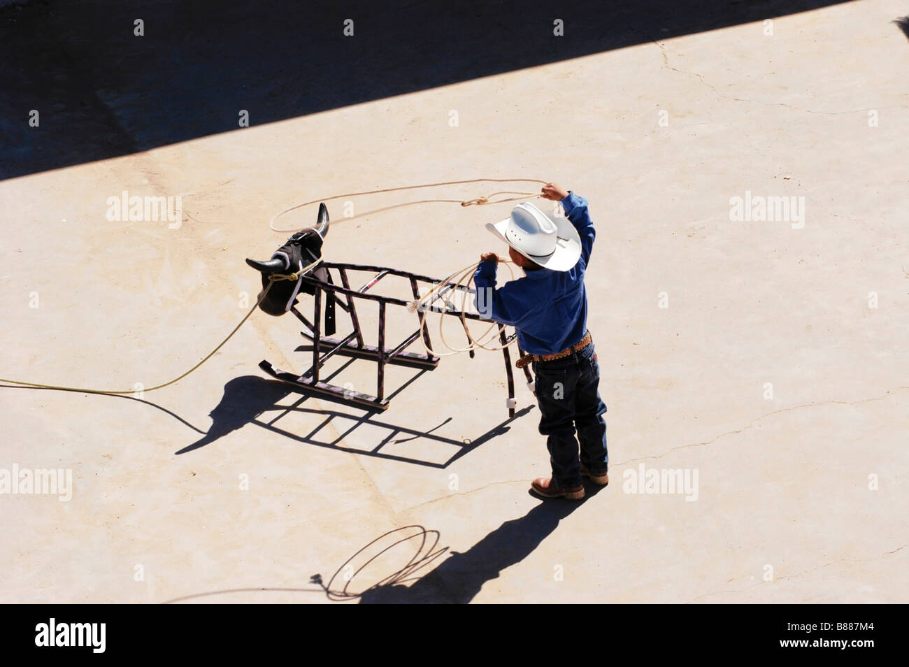 young cowboy practicing his roping skills Stock Photo - Alamy