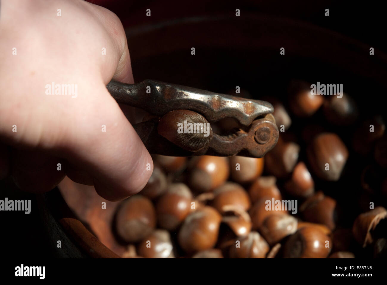 Cracking nuts hi-res stock photography and images - Alamy