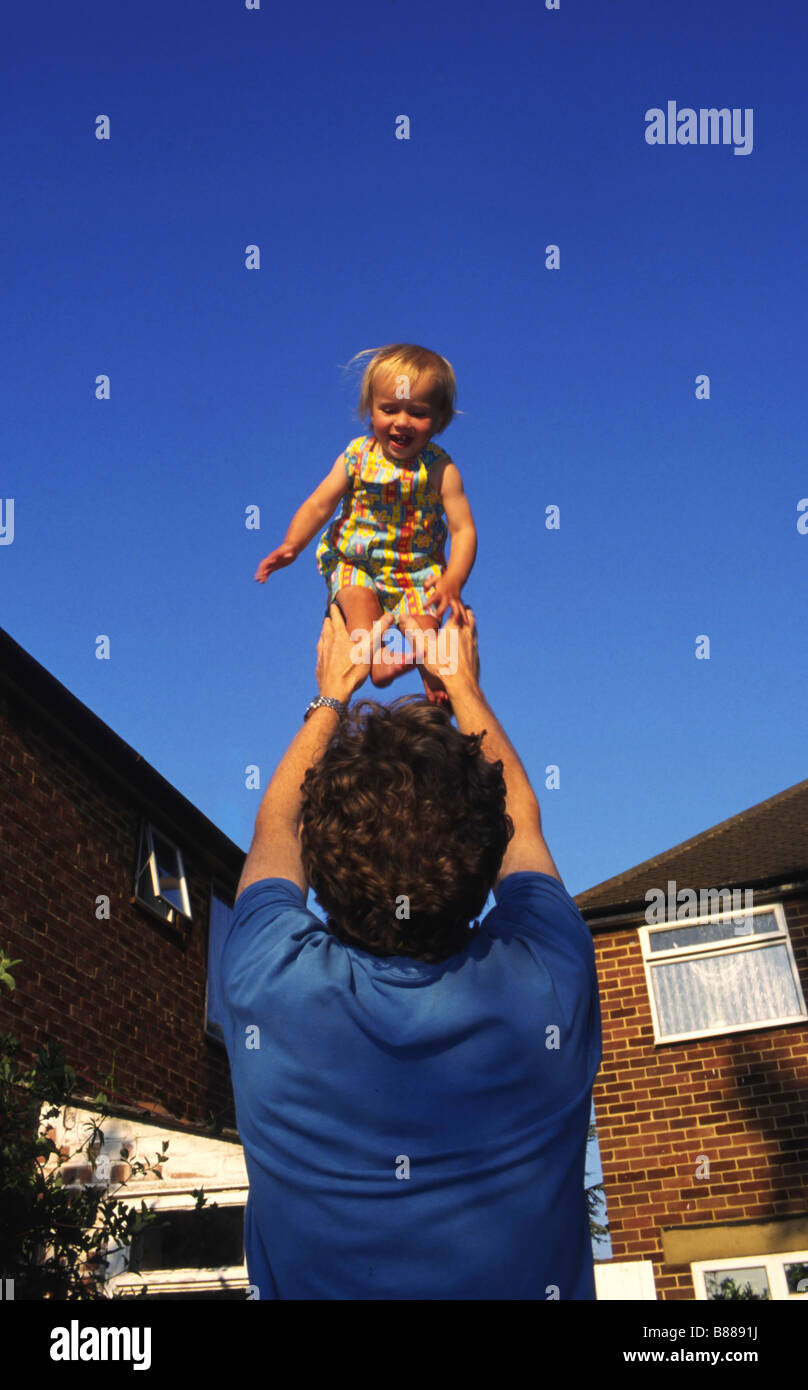 girl child tossed in air Stock Photo - Alamy