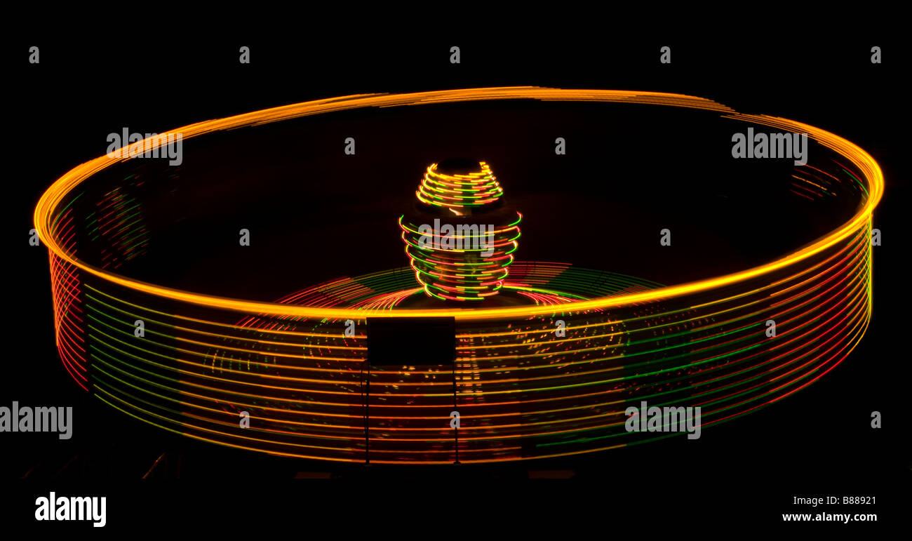 Abstract photograph of the light trails on a fun fair attraction Stock ...