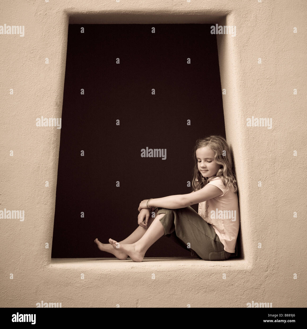 Sitting in a window Stock Photo - Alamy