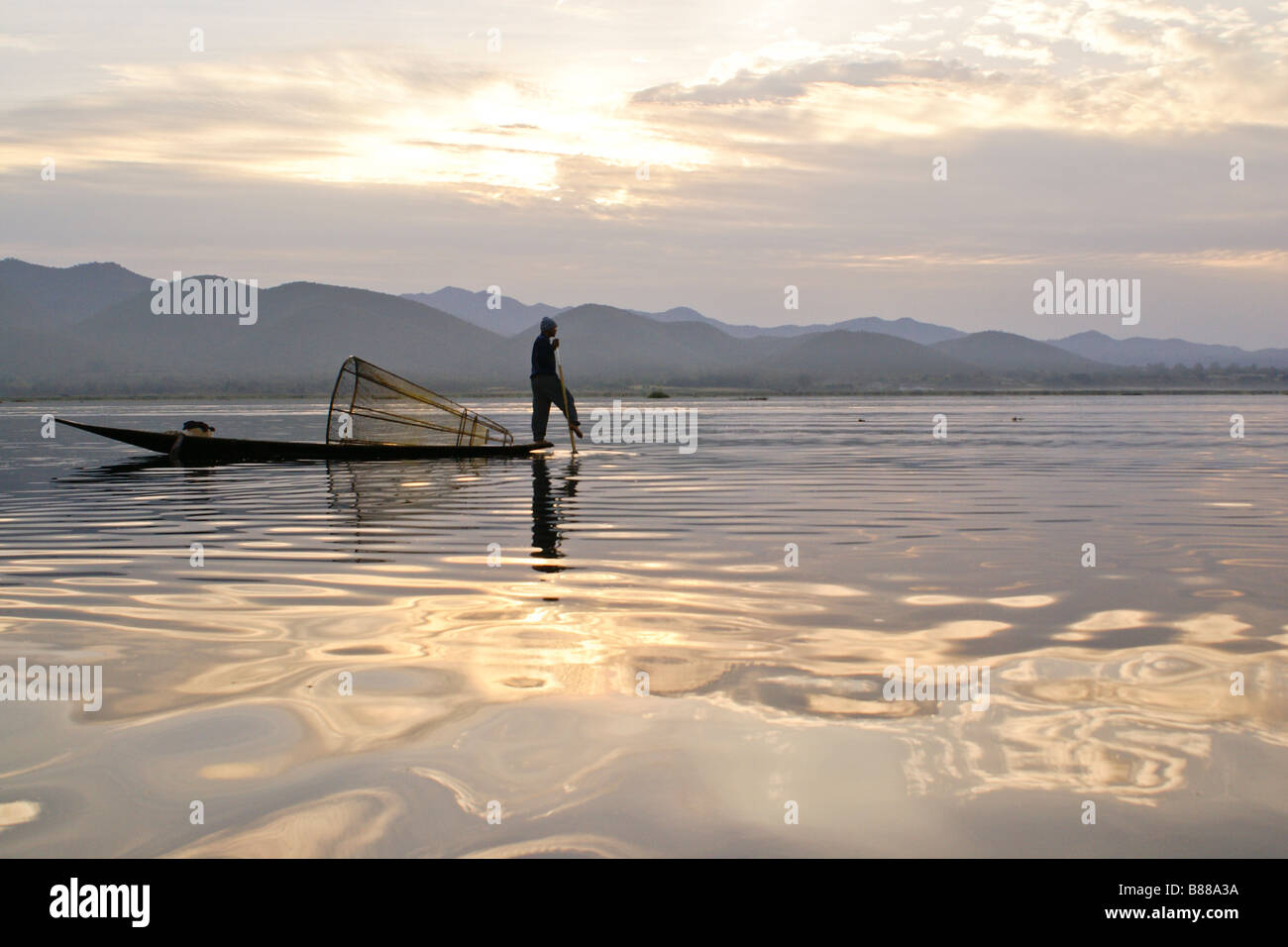 Intha leg-rowing fisherman on Inle Lake at sunrise, Myanmar (Burma ...