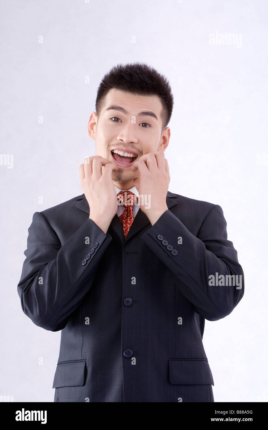 Young businesswoman scratching chin with mouth open Stock Photo - Alamy