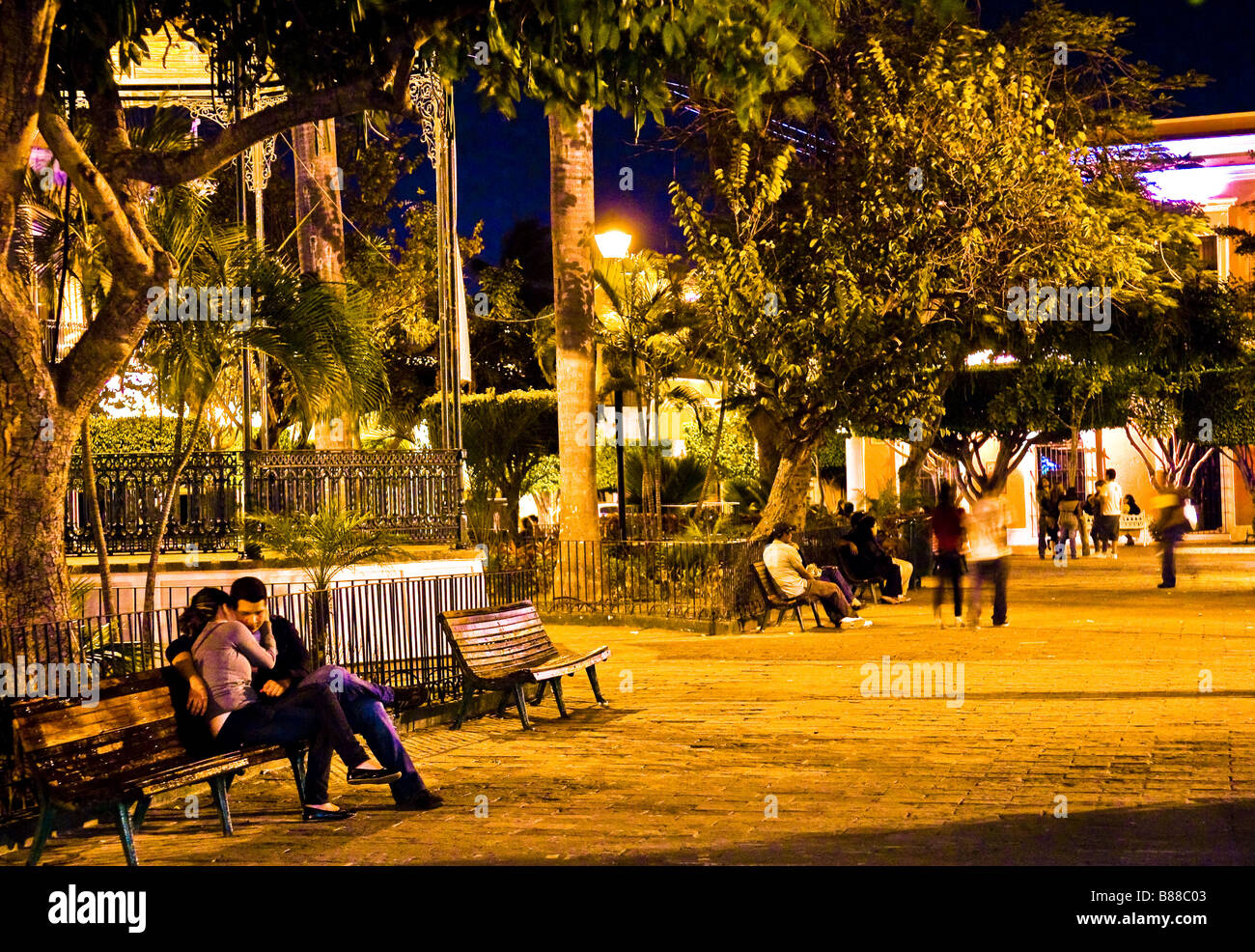 Couple on park bench at Plaza Machado in old town Mazatlan Sinaloa ...