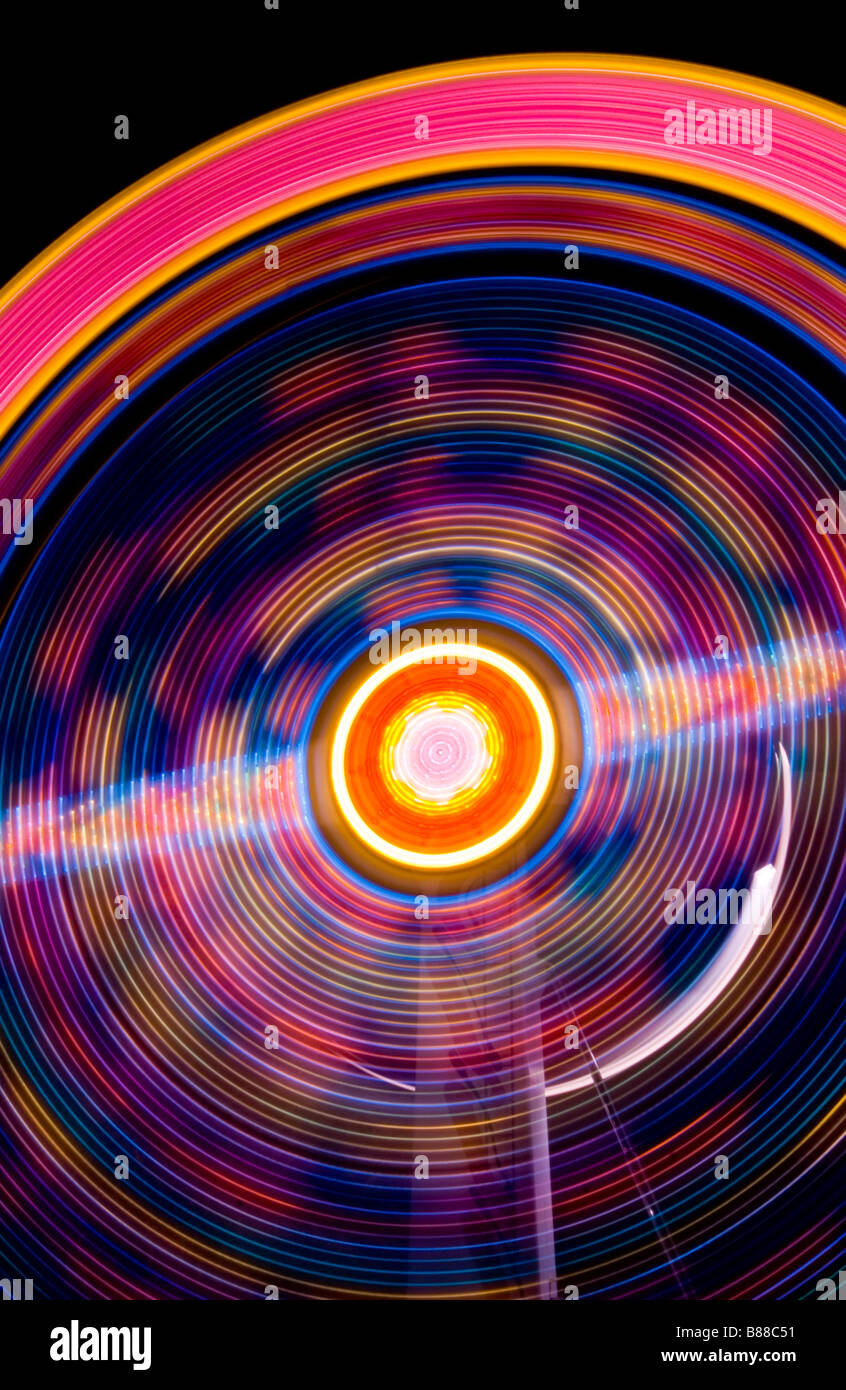 Abstract photograph of the light trails on a fun fair attraction Stock ...