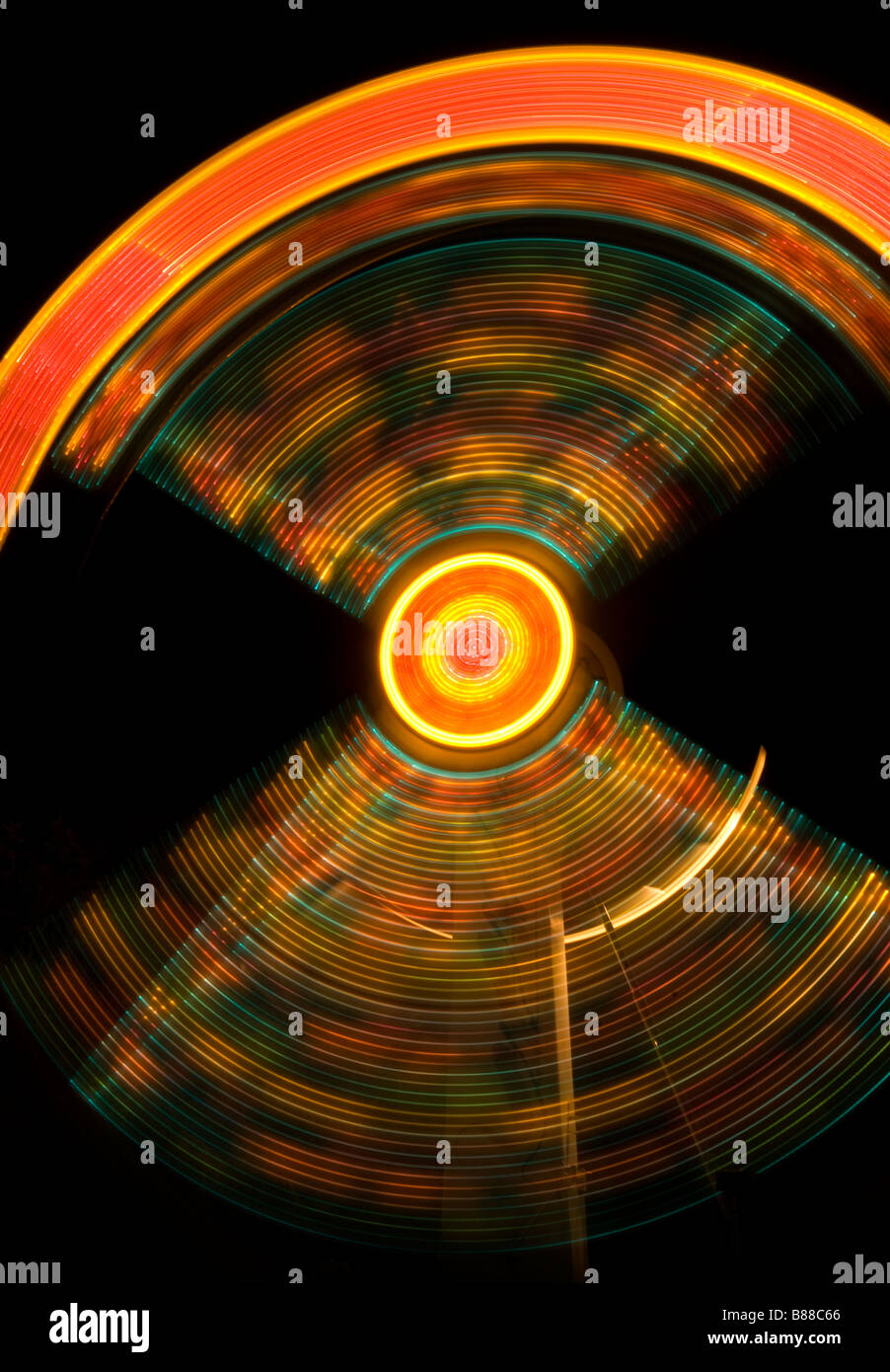 Abstract photograph of the light trails on a fun fair attraction Stock ...