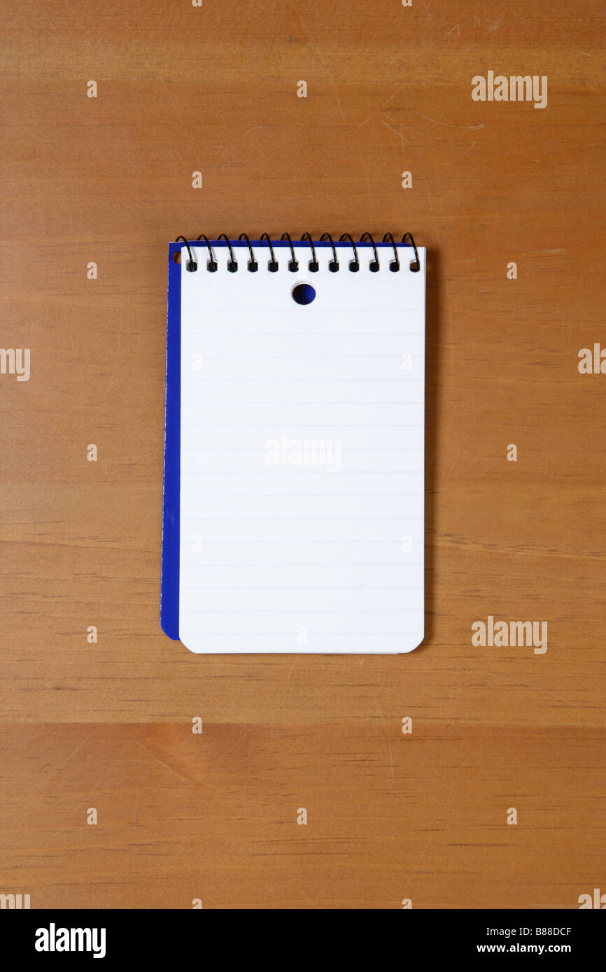 A blank note pad on a desk in an office Stock Photo - Alamy