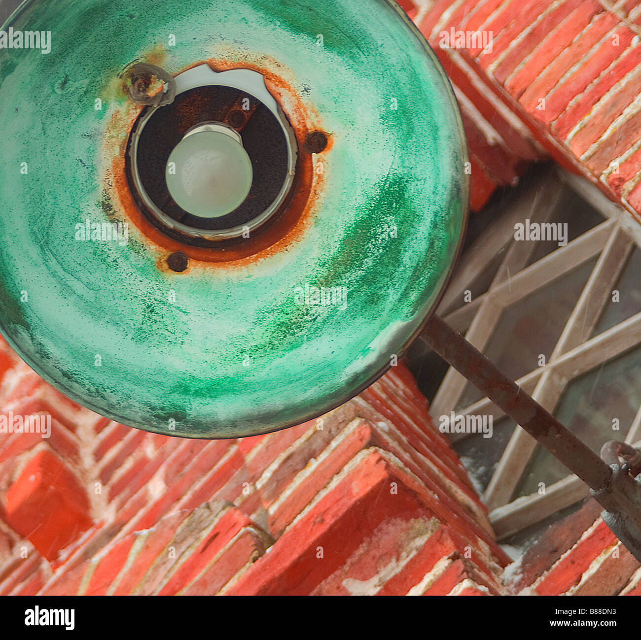 Corroded old lamp, from which the copper inside has turned green ...